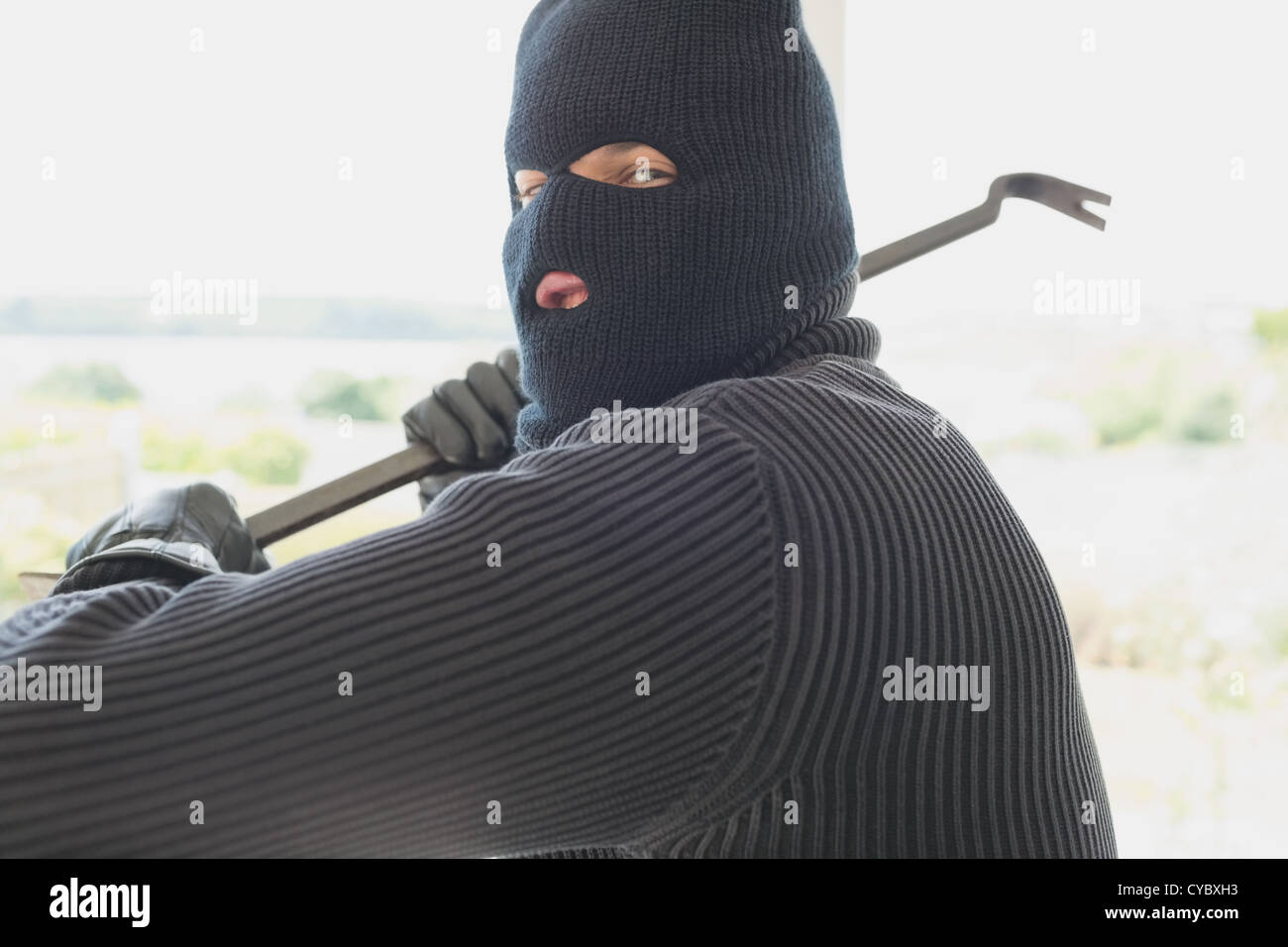Thief crowbar in hand hi-res stock photography and images - Alamy