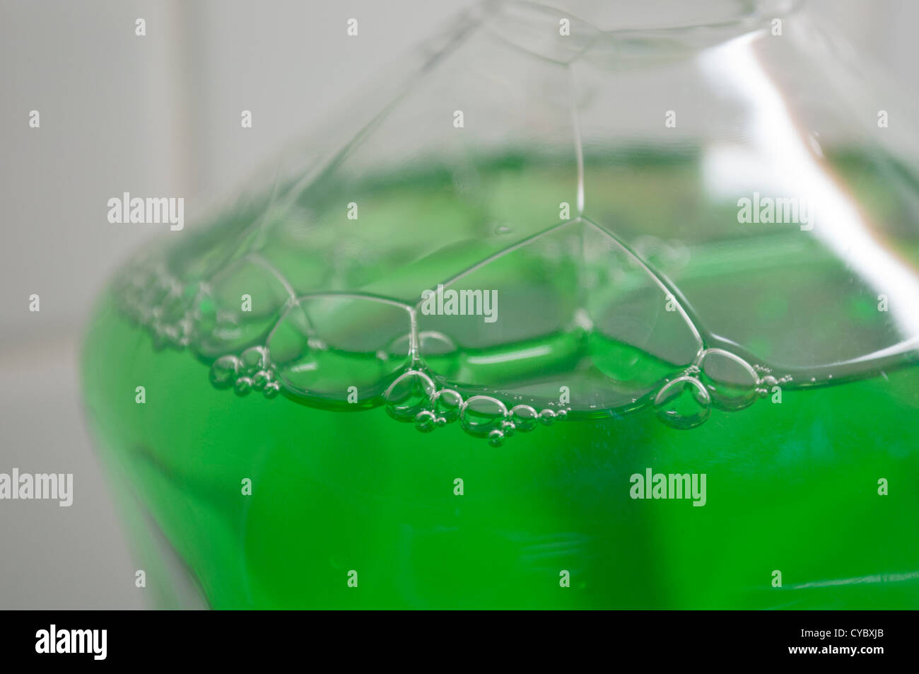 Green washing up liquid Stock Photo - Alamy