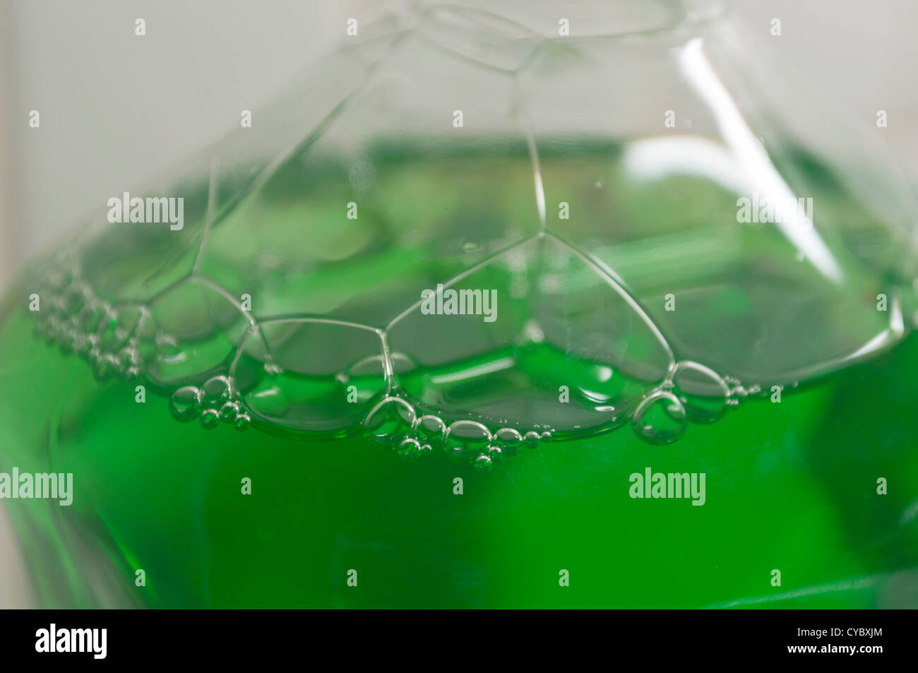 Green washing up liquid Stock Photo - Alamy