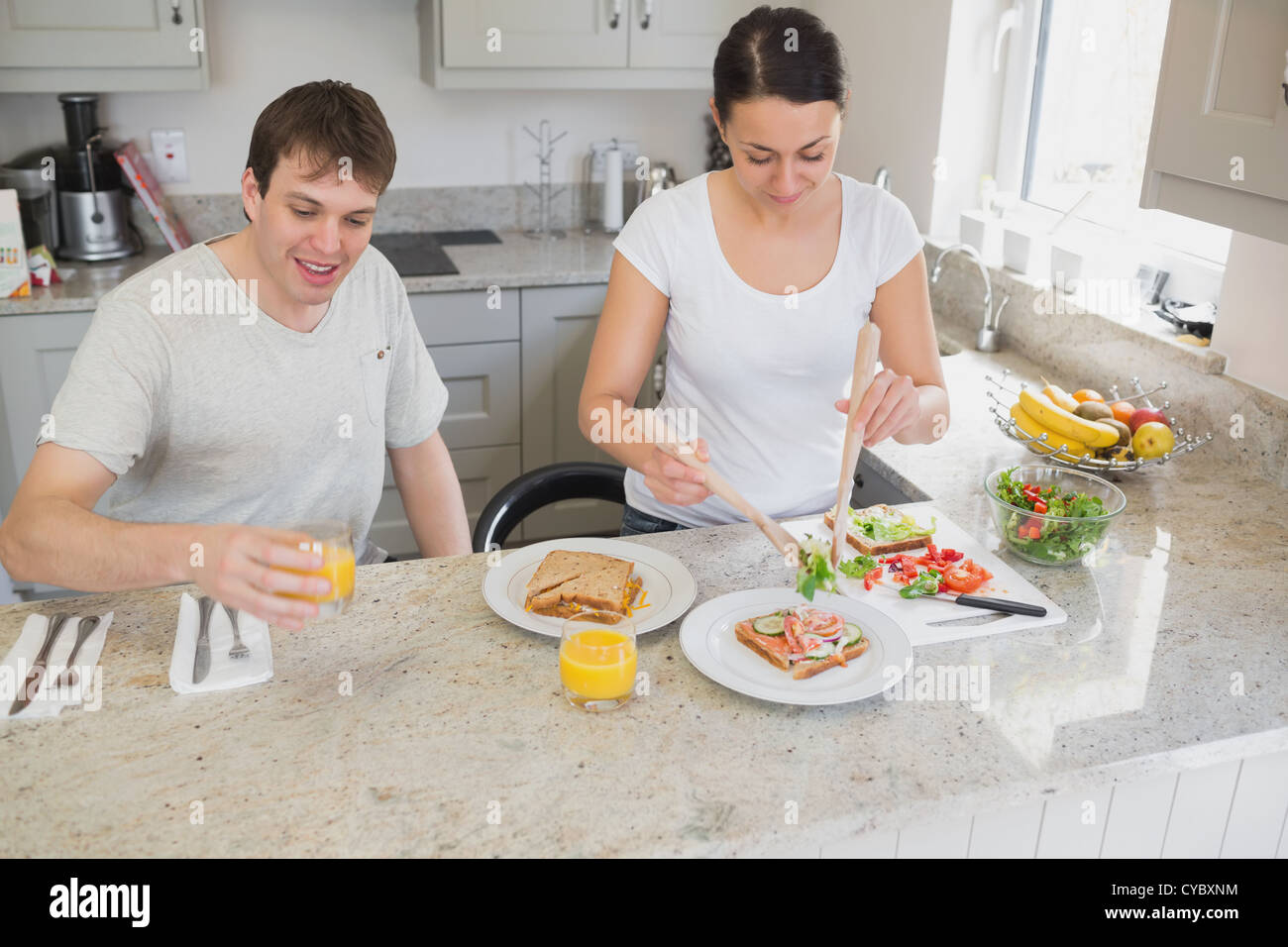 Wife making sandwiches for lunch Stock Photo - Alamy
