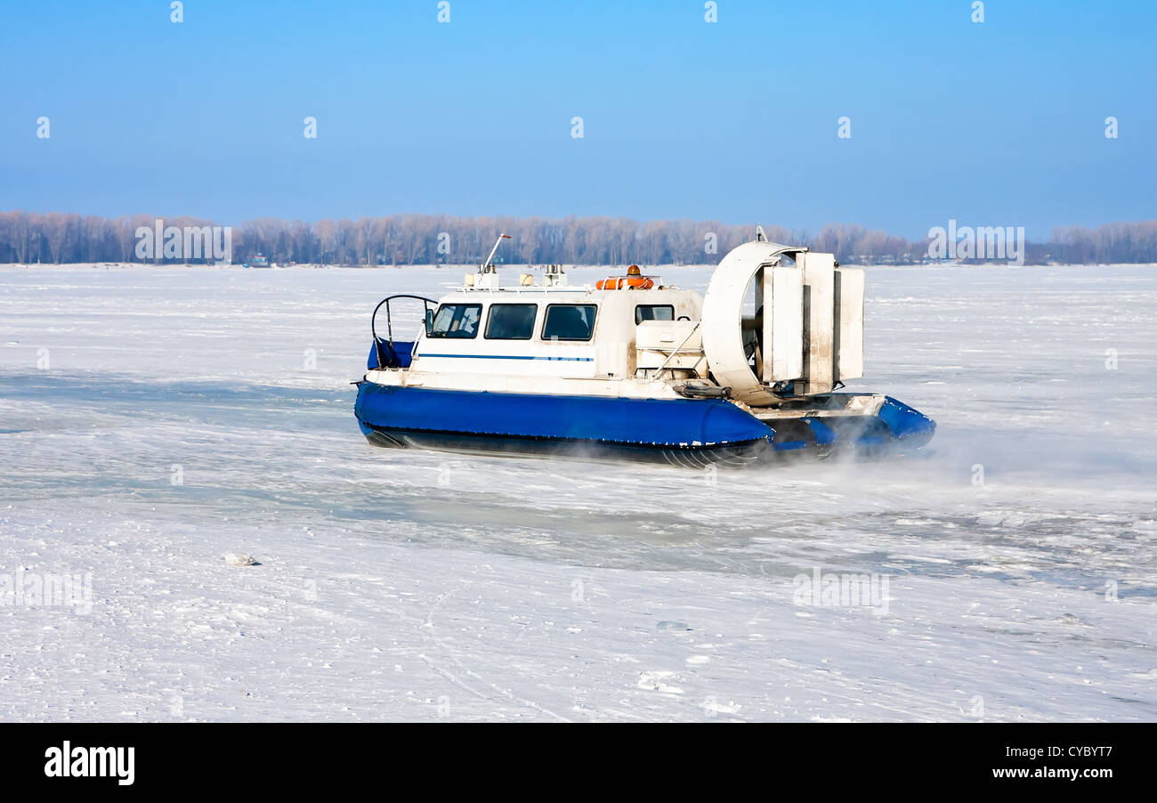 Hovercraft crossing frozen river Stock Photo - Alamy