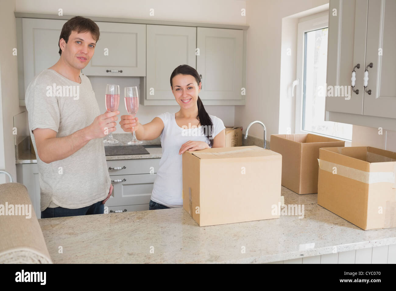 Two young people celebrating their move Stock Photo - Alamy
