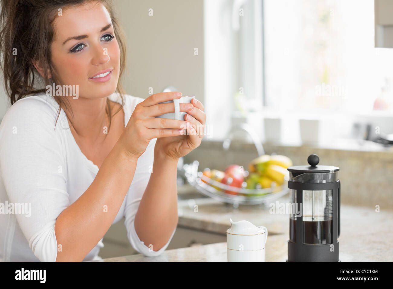 Woman thinking over coffee at breakfast Stock Photo - Alamy