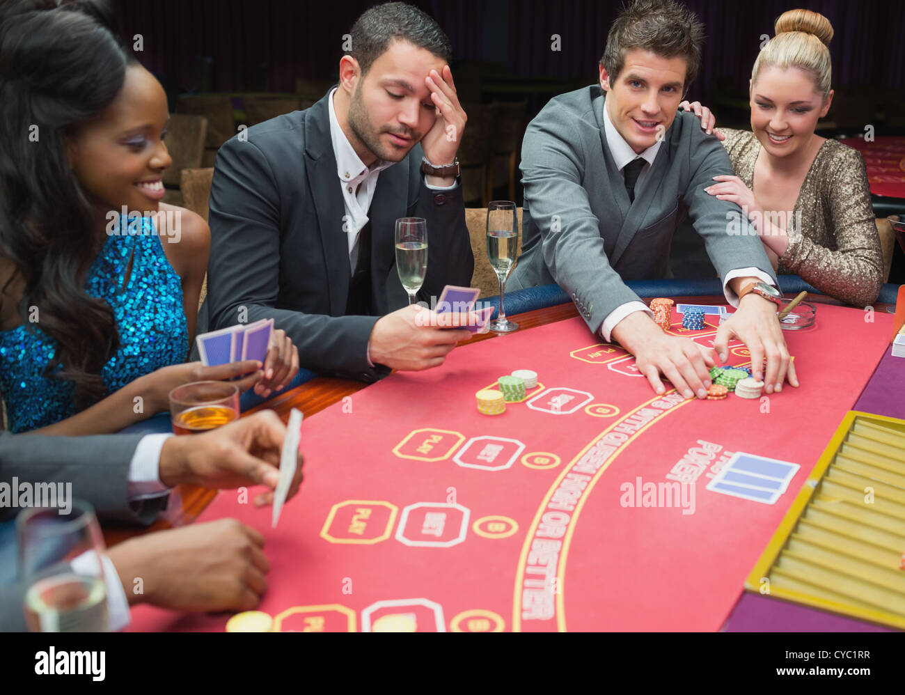 Smiling man claiming the pot Stock Photo - Alamy