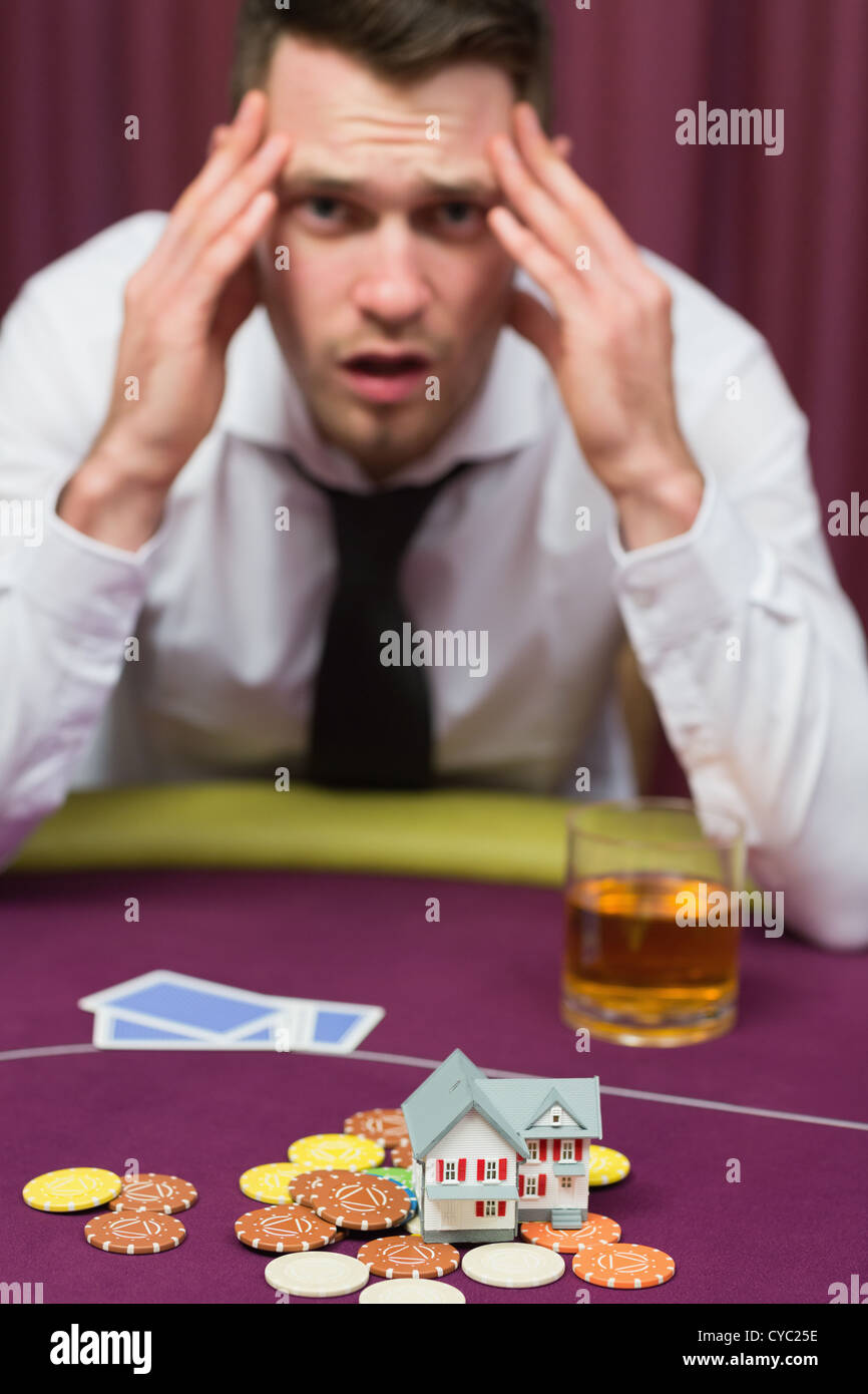 Man losing his house at poker game Stock Photo - Alamy