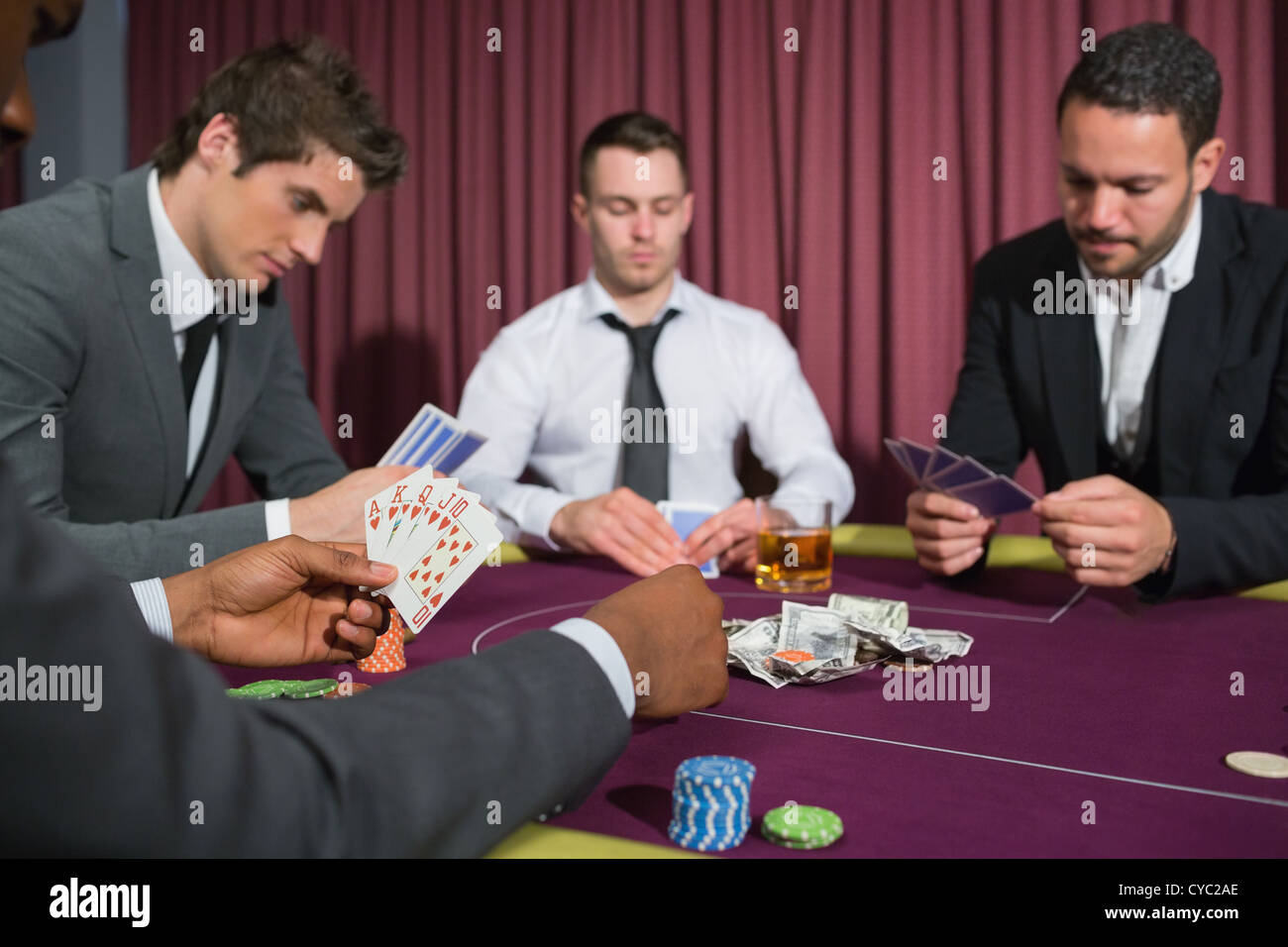 Men at the poker table Stock Photo - Alamy