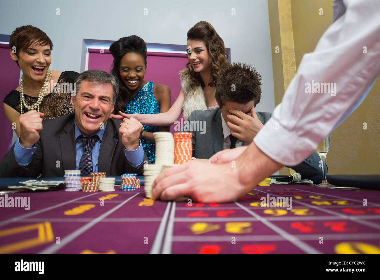 Smiling man celebrating roulette hi-res stock photography and images ...