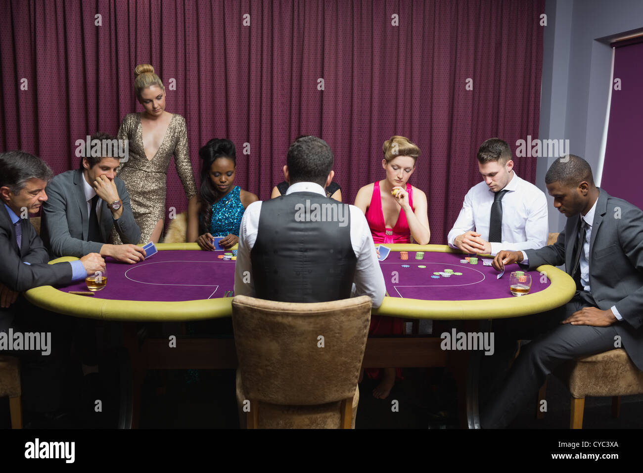 People sitting poker table playing hi-res stock photography and images ...