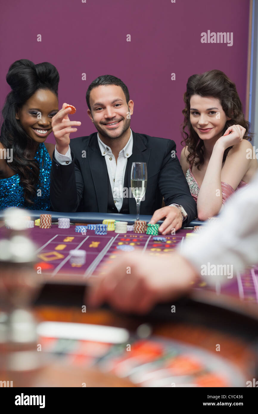 Man women smiling casino table hi-res stock photography and images - Alamy