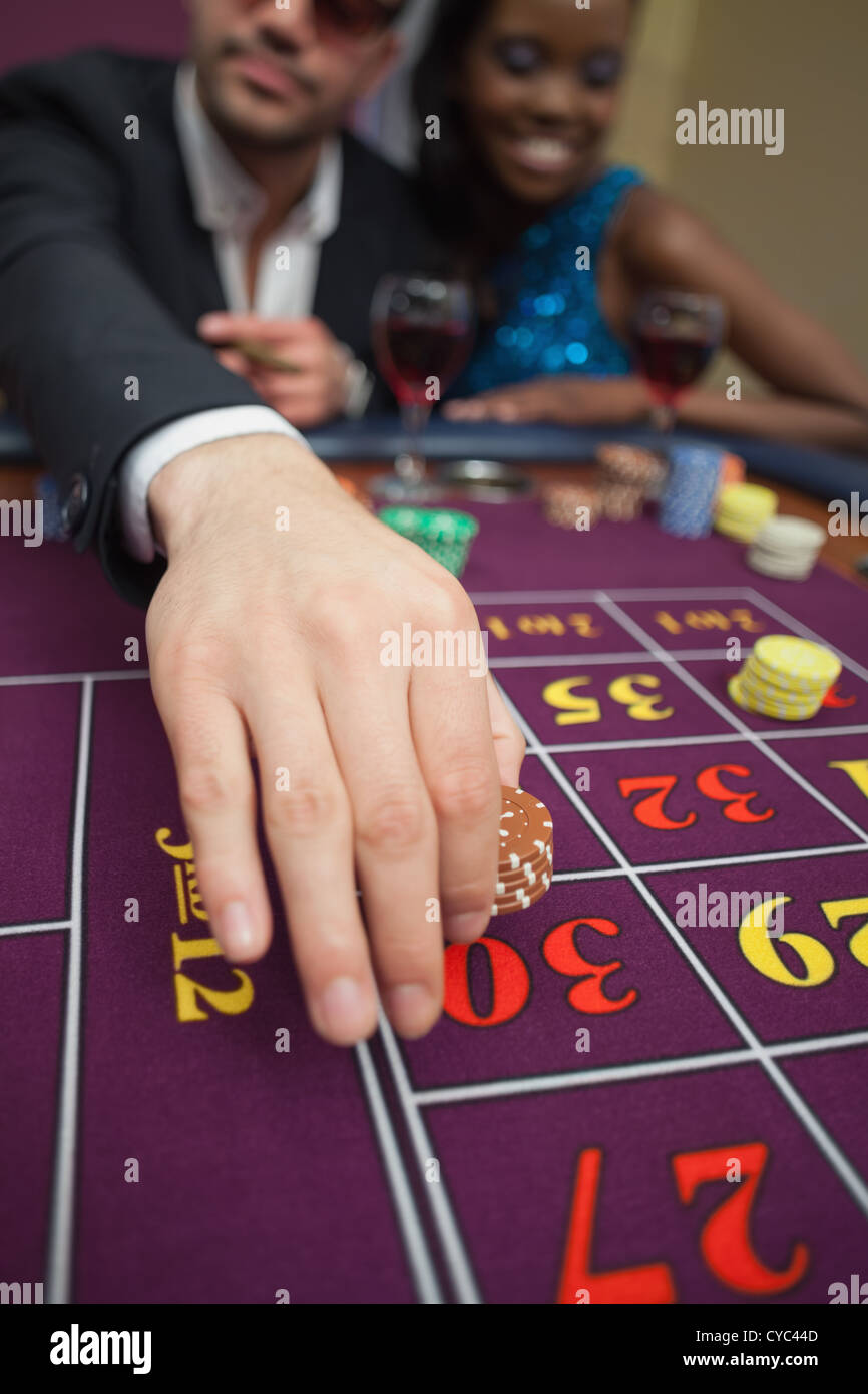 Placing bet on roulette table hi-res stock photography and images - Alamy