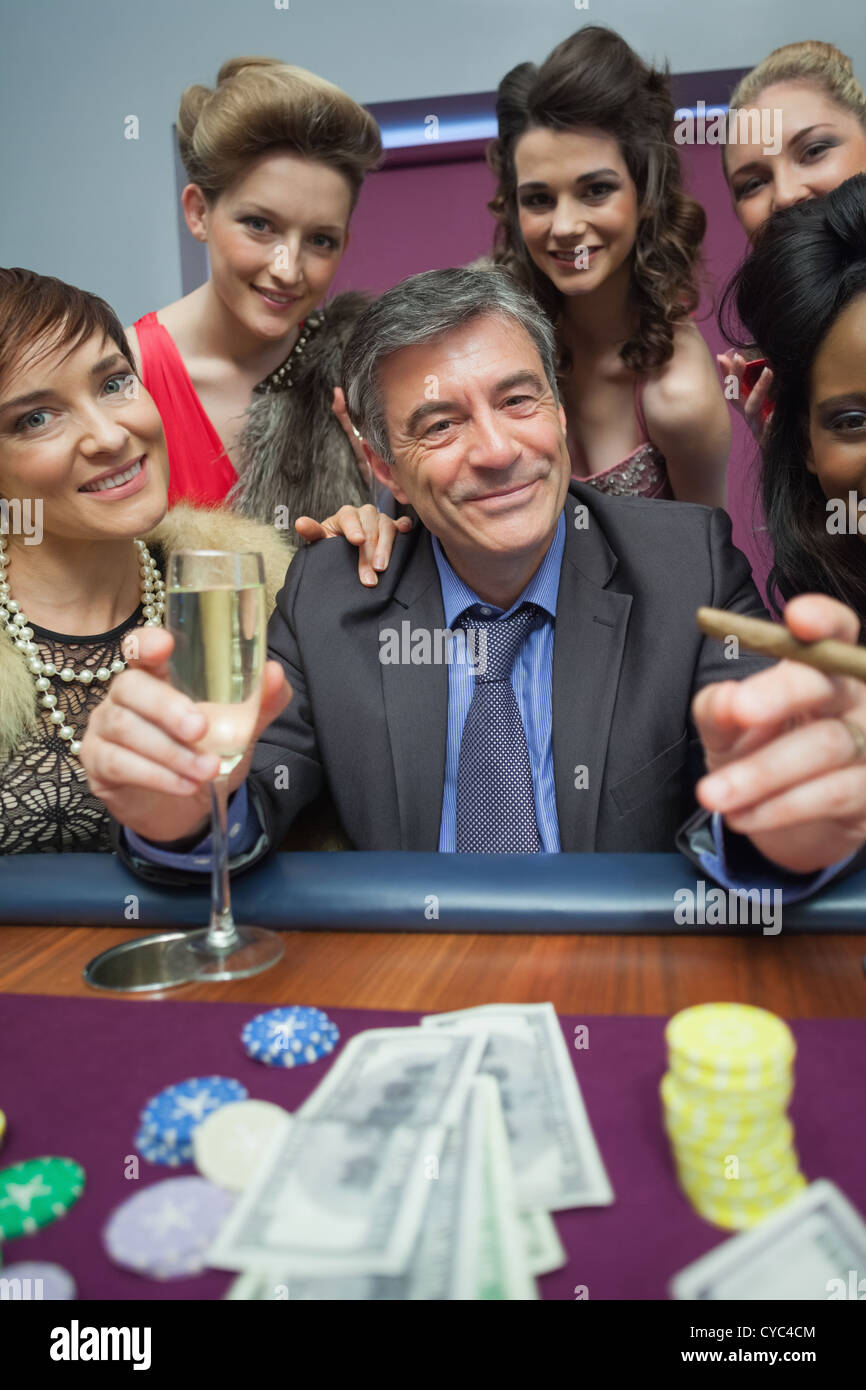 Woman with champagne glass and cigar hi-res stock photography and ...