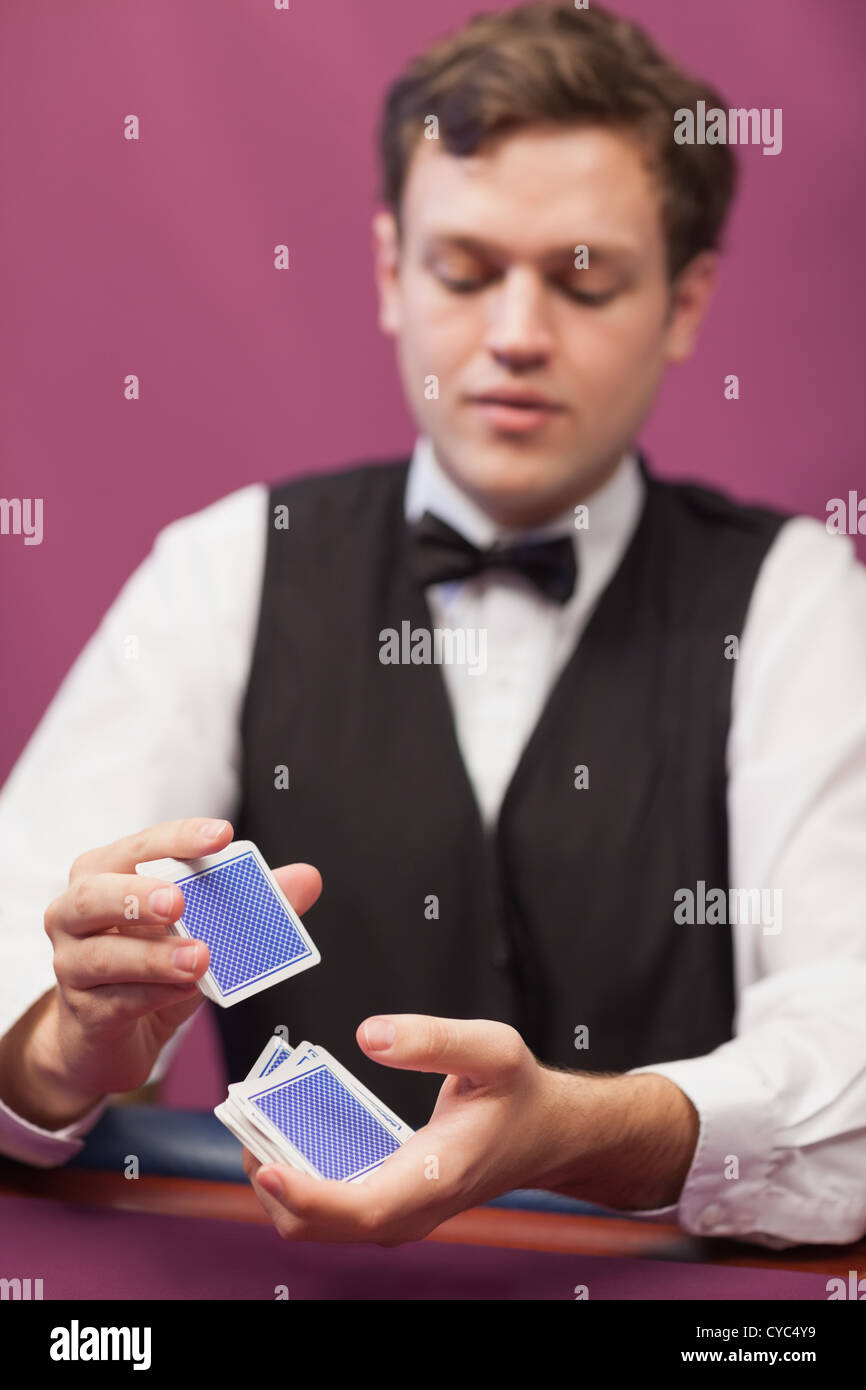 Young man dealing cards hi-res stock photography and images - Alamy