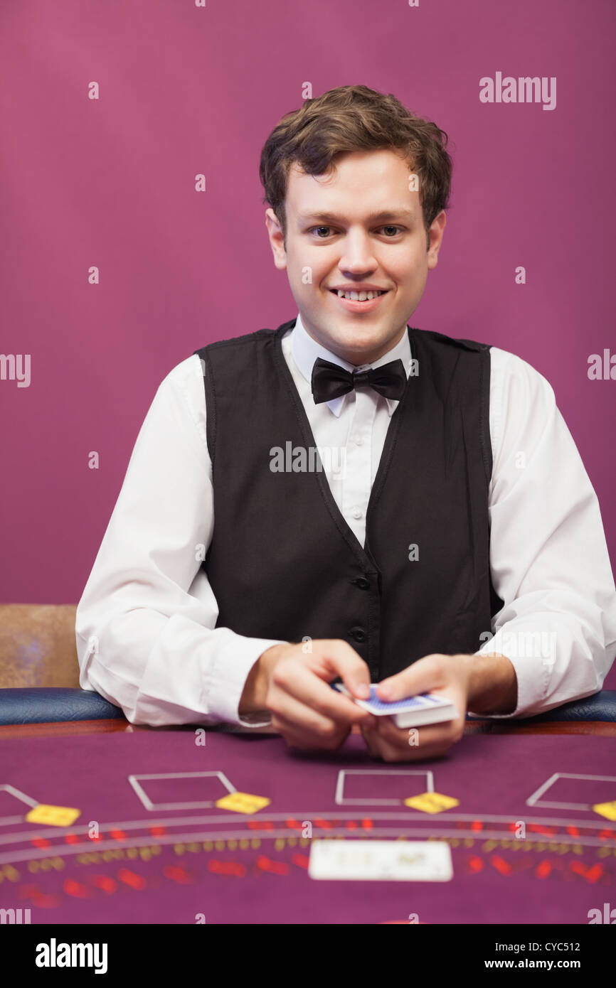 Young man dealing cards hi-res stock photography and images - Alamy