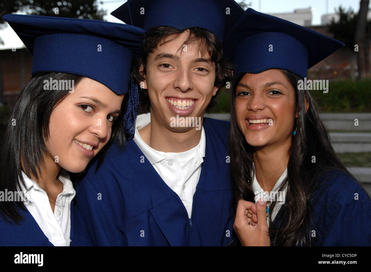 Three young Latinos in the high school graduation ceremony Stock Photo ...