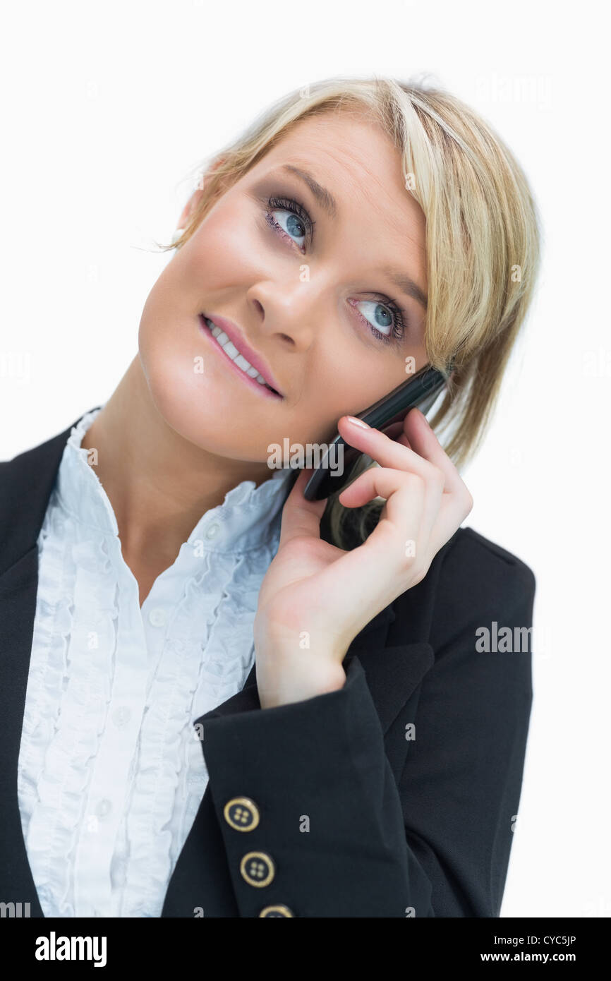 Blonde smiling while calling Stock Photo - Alamy