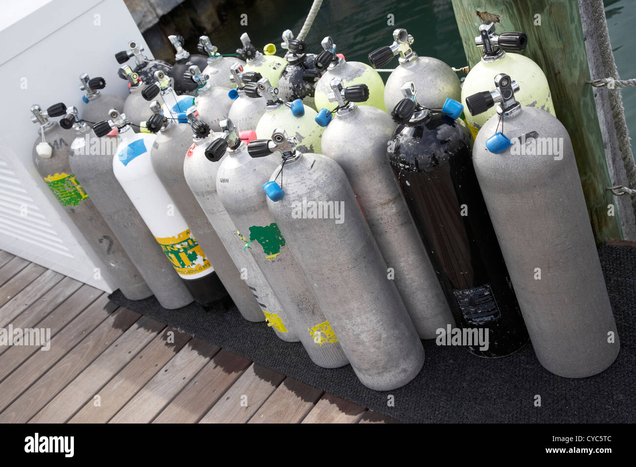 scuba air tanks lined up on jetty to be filled in harbour key west ...