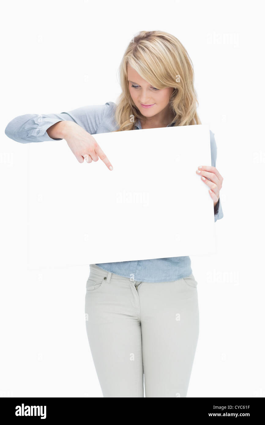 Woman pointing on the piece of paper Stock Photo - Alamy