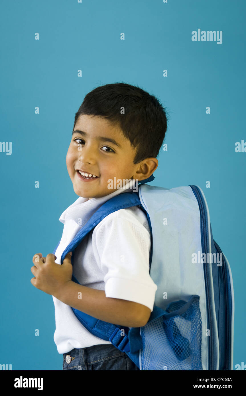 Young Latin boy with backpack Stock Photo - Alamy