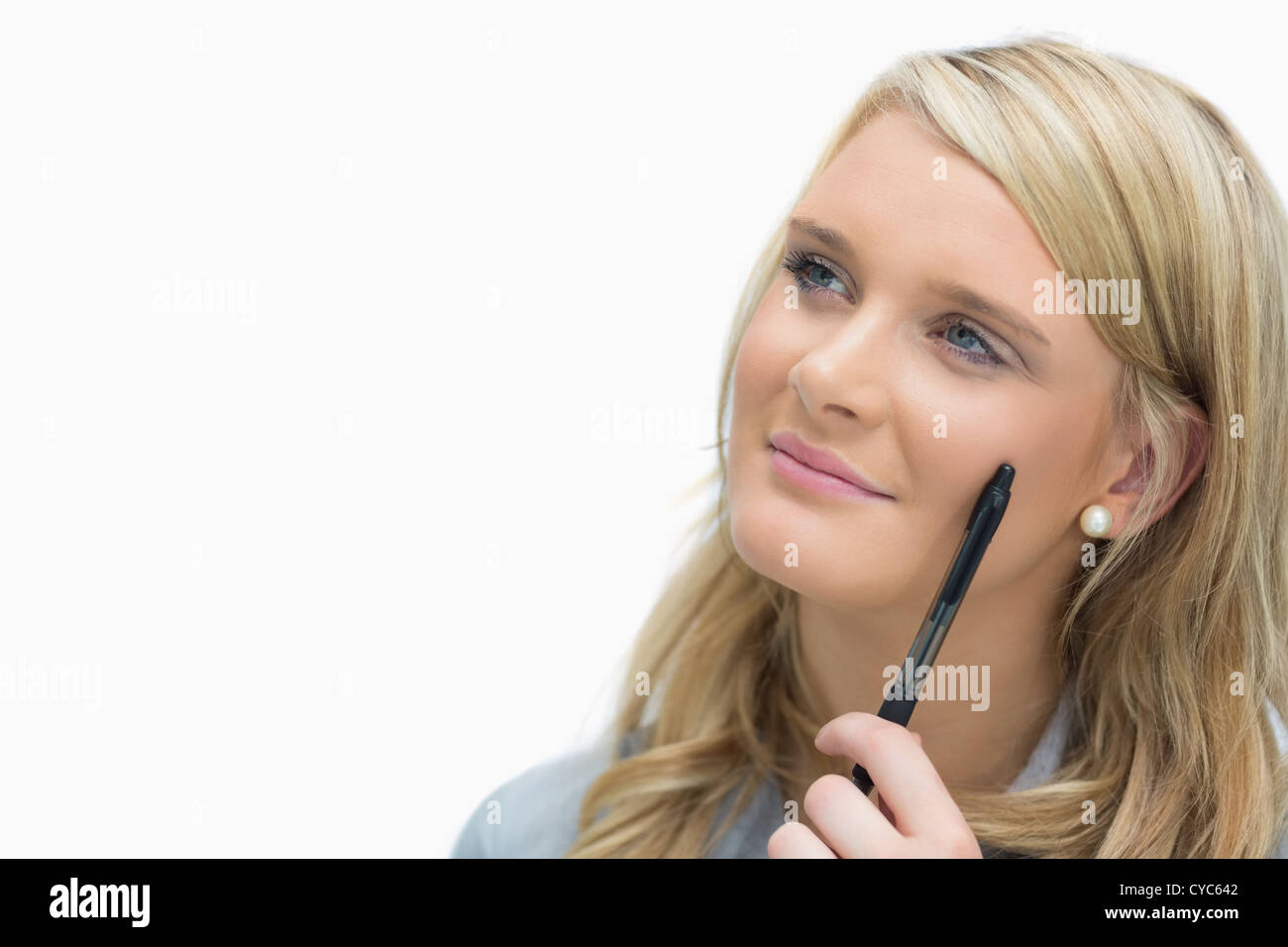 Woman looking up while thinking Stock Photo - Alamy