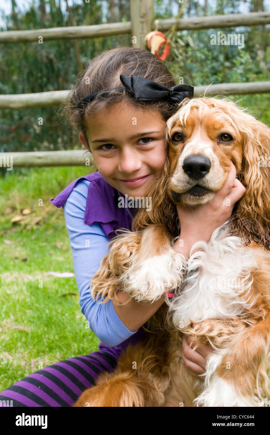 Girl playing with her cocker spaniel Stock Photo - Alamy