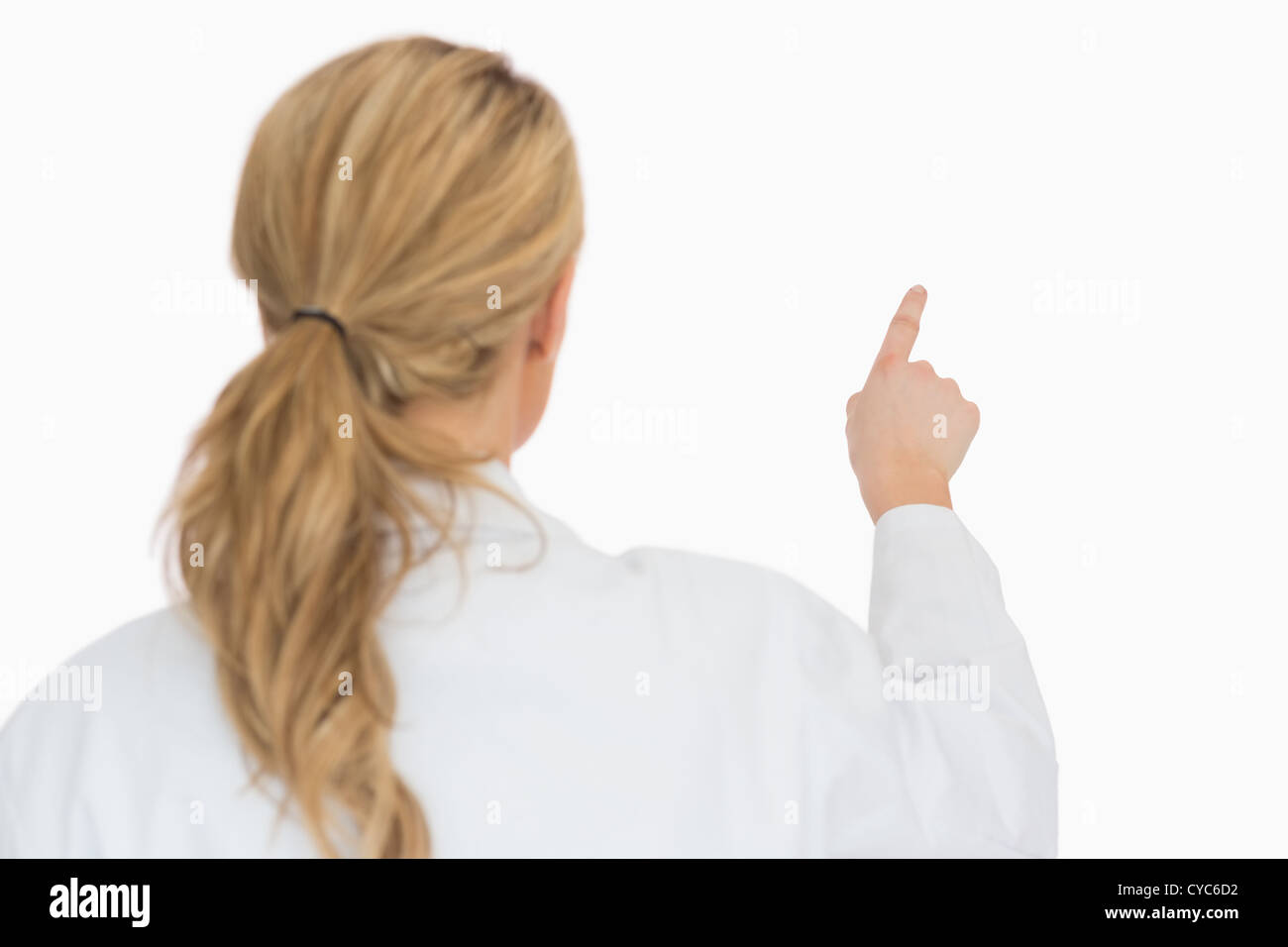 Doctor pointing from behind Stock Photo - Alamy