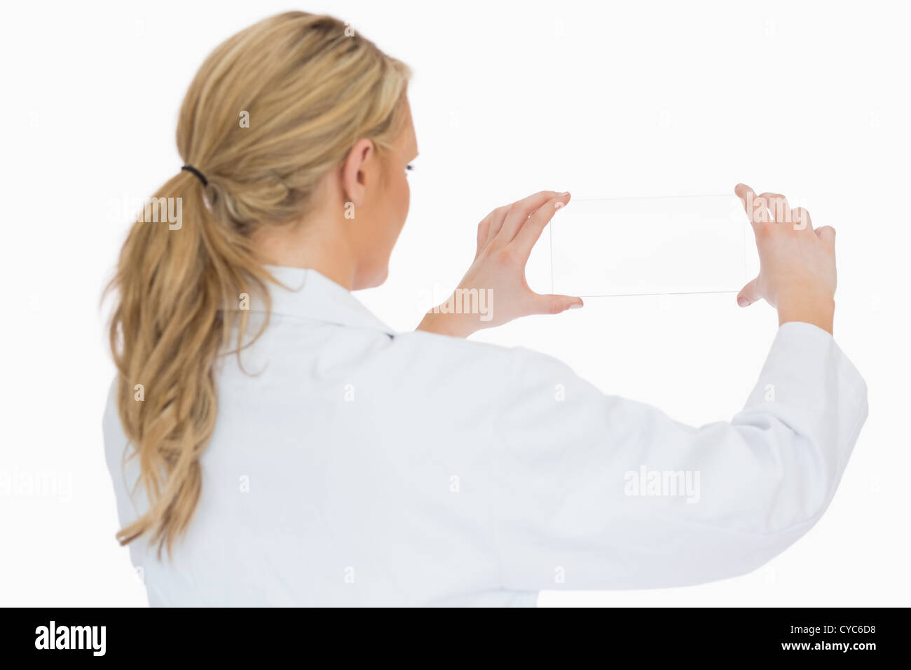 Doctor holding glass slide from behind Stock Photo - Alamy
