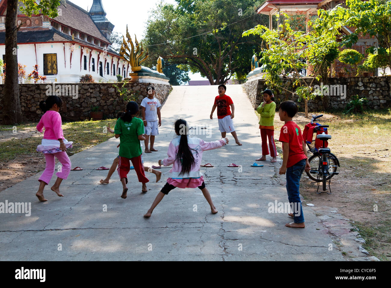 Children playing on the Street in Luang Prabang, Laos Stock Photo - Alamy