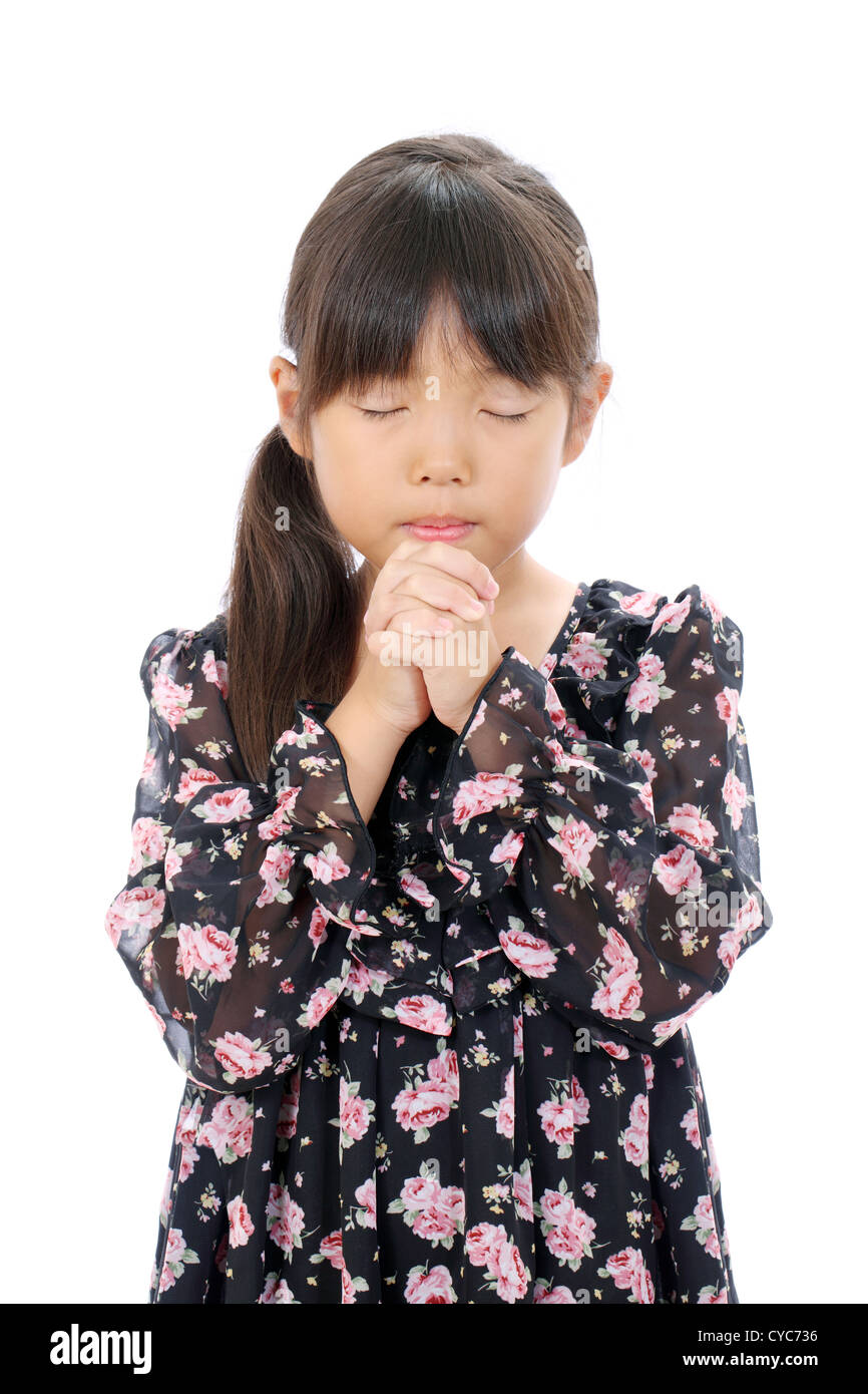 Studio photo of little asian girl praying Stock Photo - Alamy