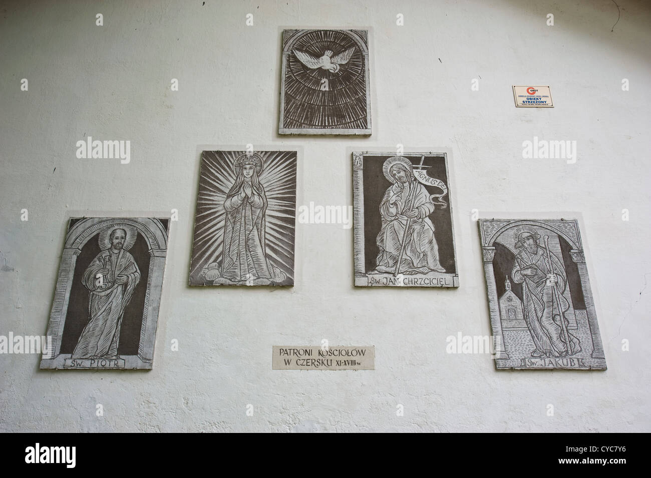 Religious relief sculptures on the church in Czersk, Mazovia, Poland ...