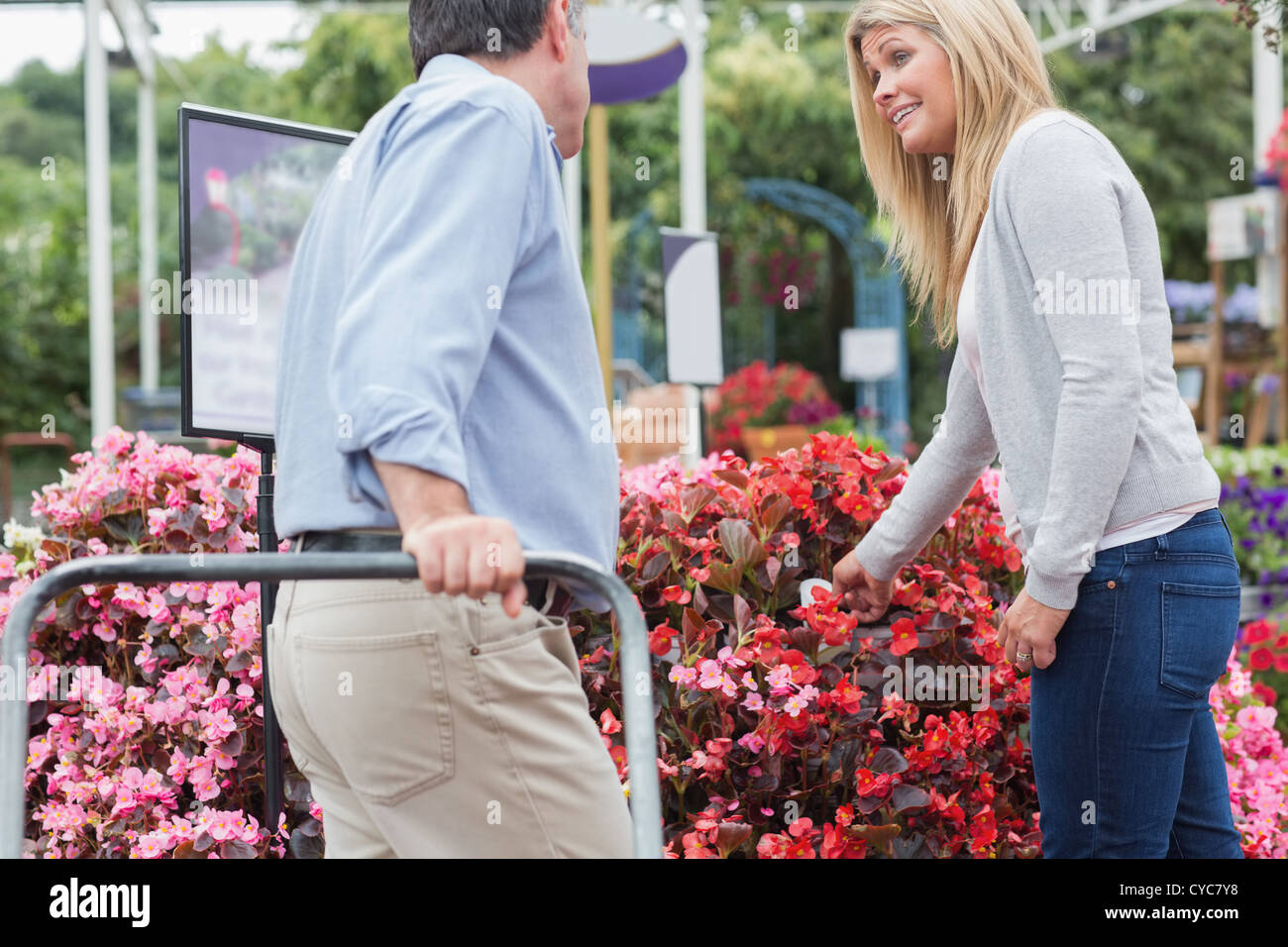 Man pushing the trolley while talking Stock Photo - Alamy
