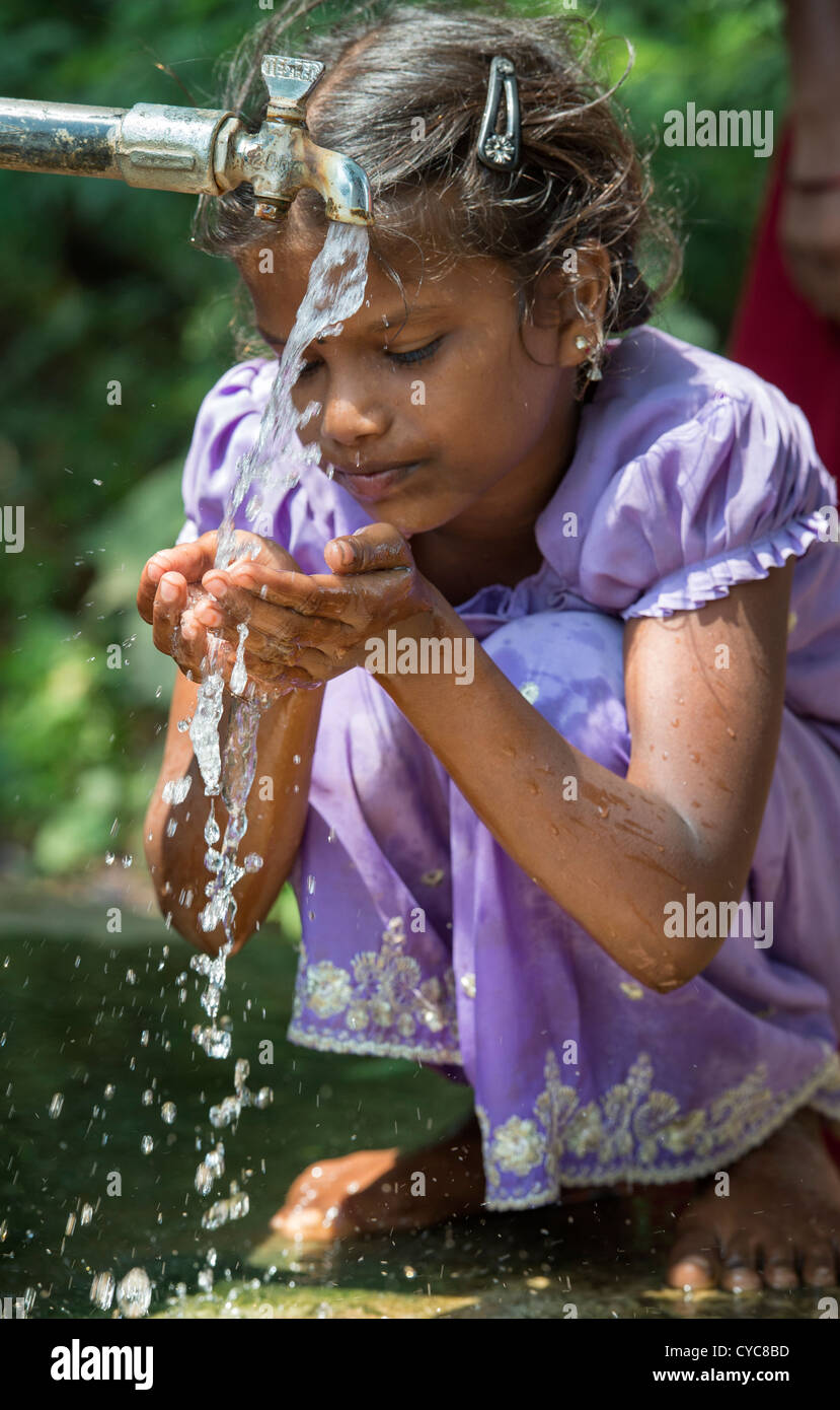 Ethnic child drinking water from tap hi-res stock photography and ...