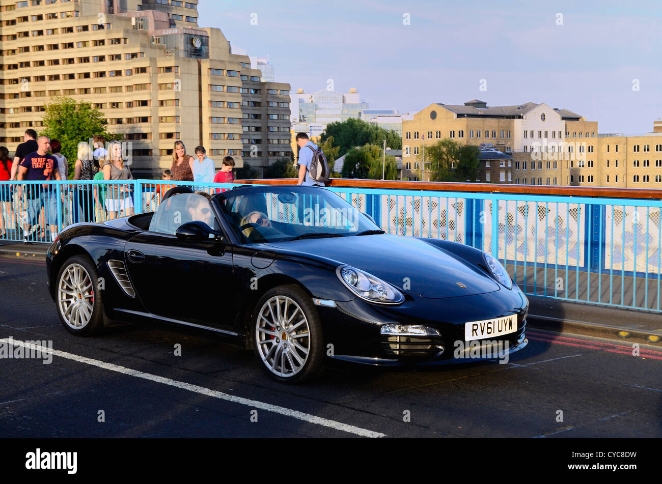 Porsche car on Tower Bridge London with tourists Stock Photo - Alamy
