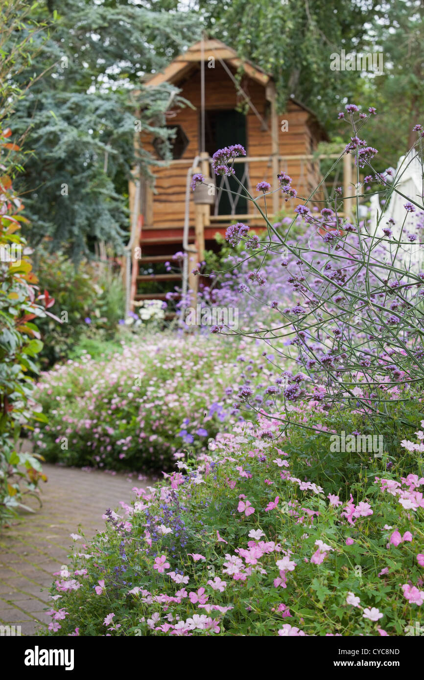 Garden with path and shed Stock Photo - Alamy