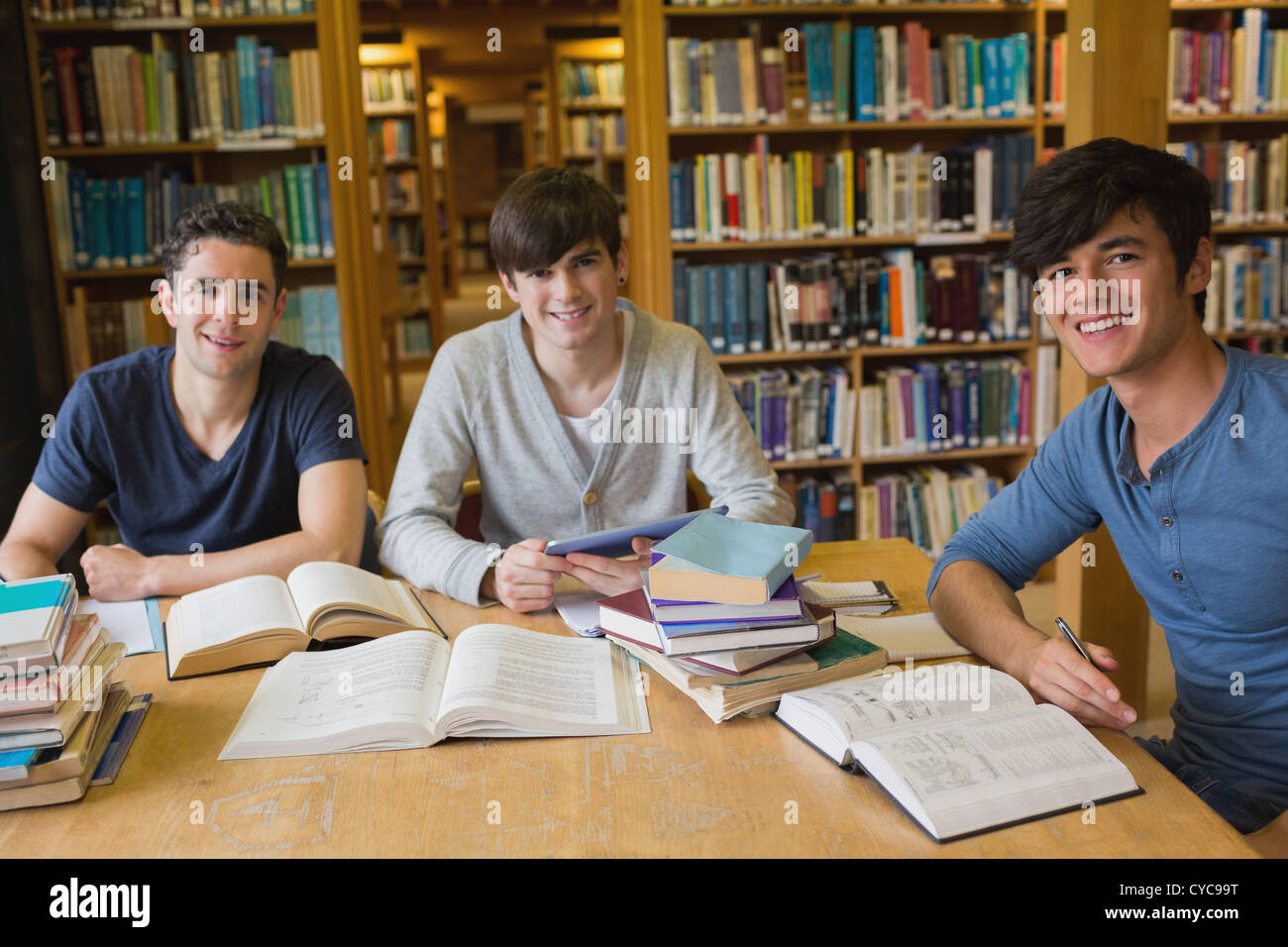 Students looking up from studying Stock Photo - Alamy