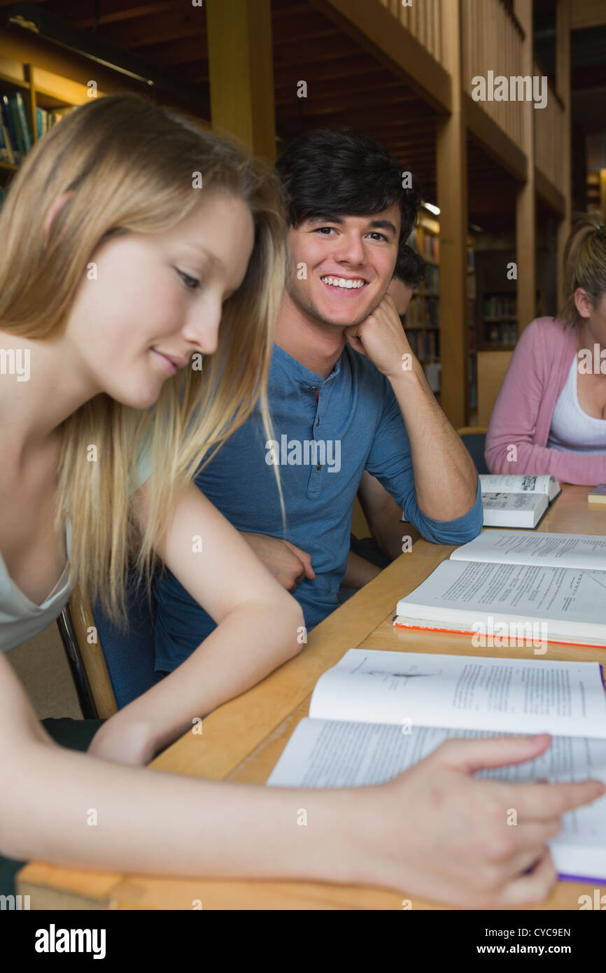 Student looking up from study group Stock Photo - Alamy