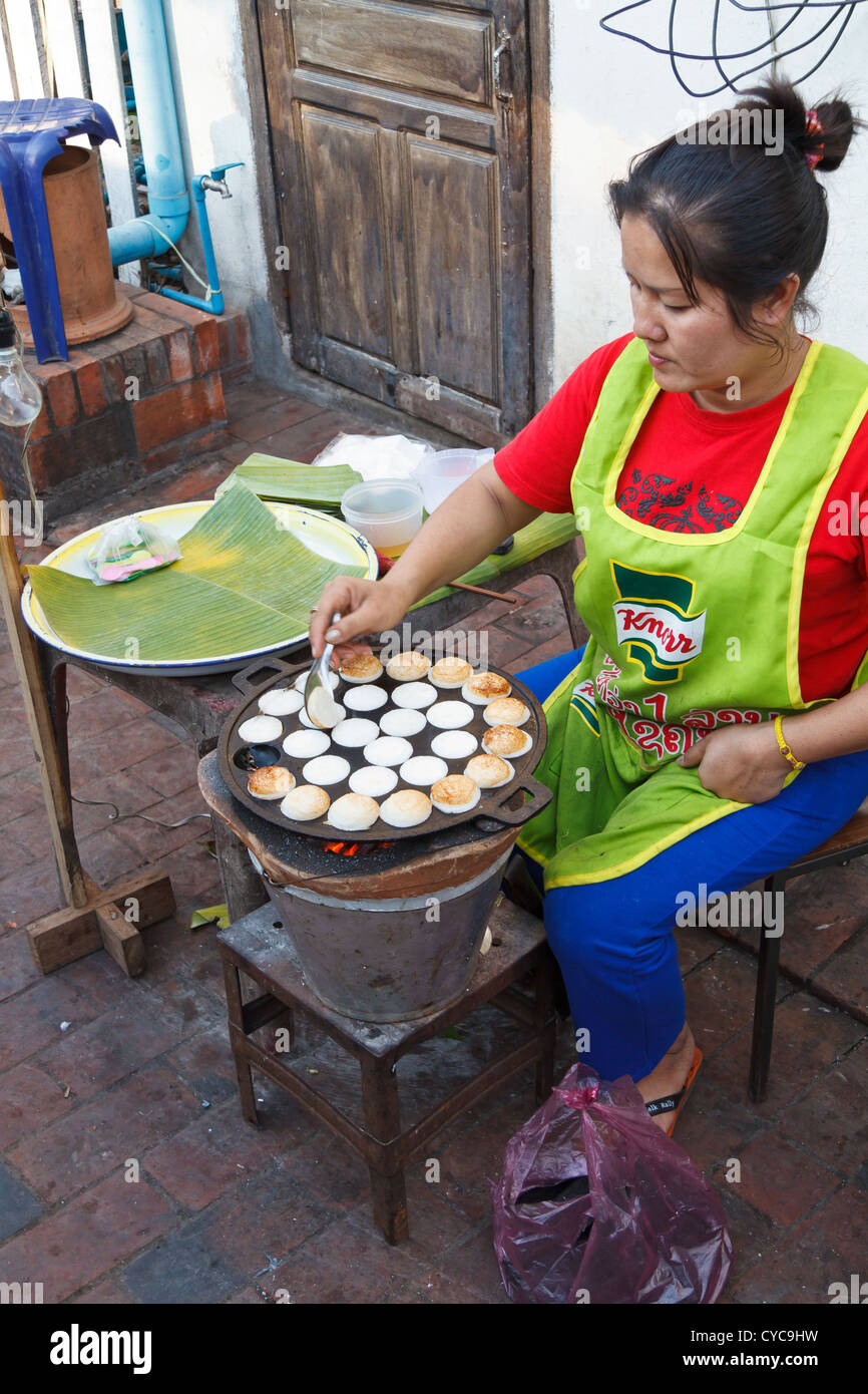 Woman frying egg street hi-res stock photography and images - Alamy