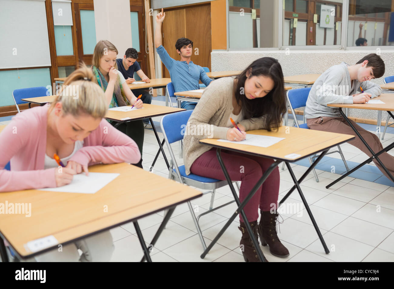 Students sitting at the classroom Stock Photo - Alamy