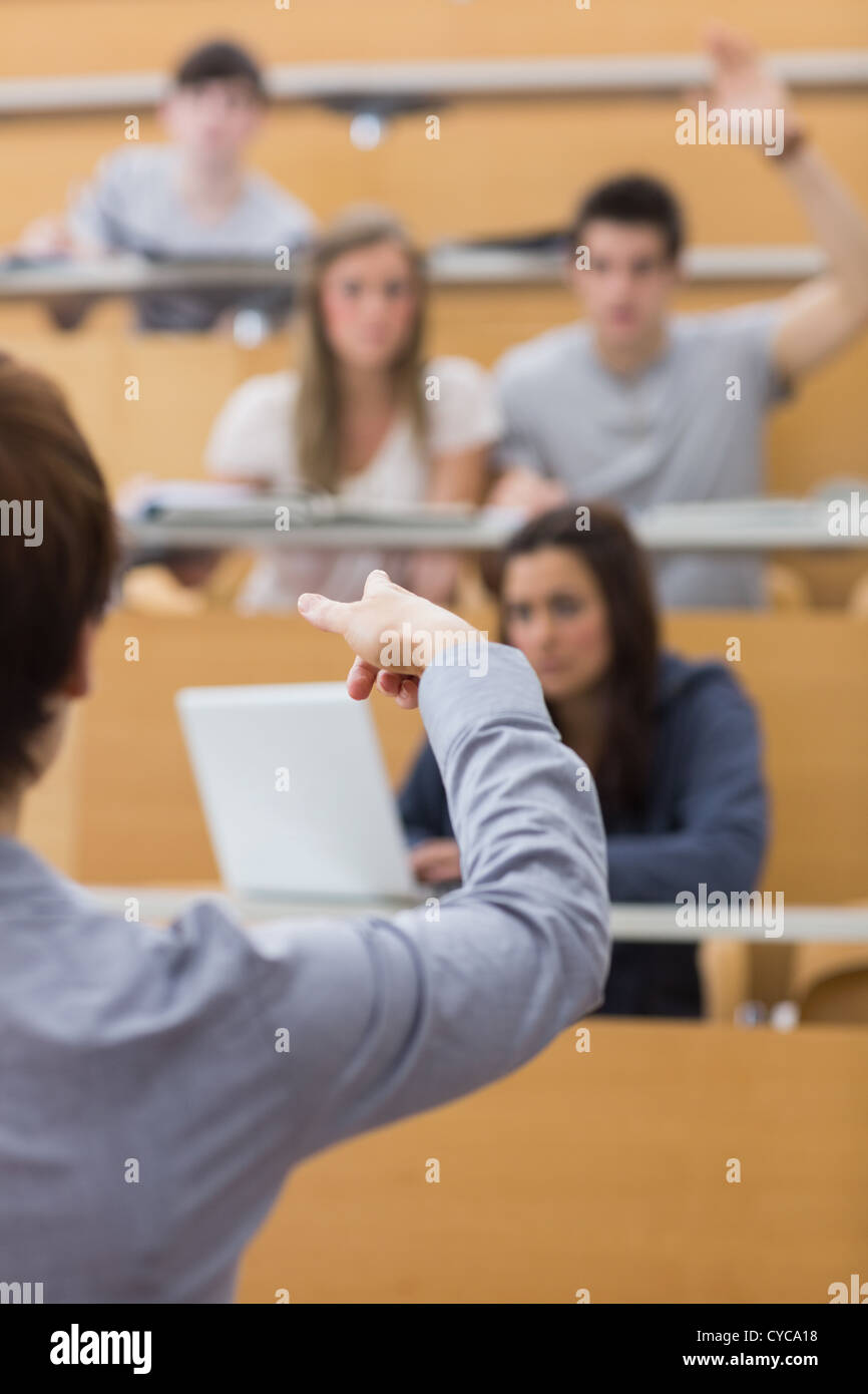 Teacher pointing to the man Stock Photo - Alamy