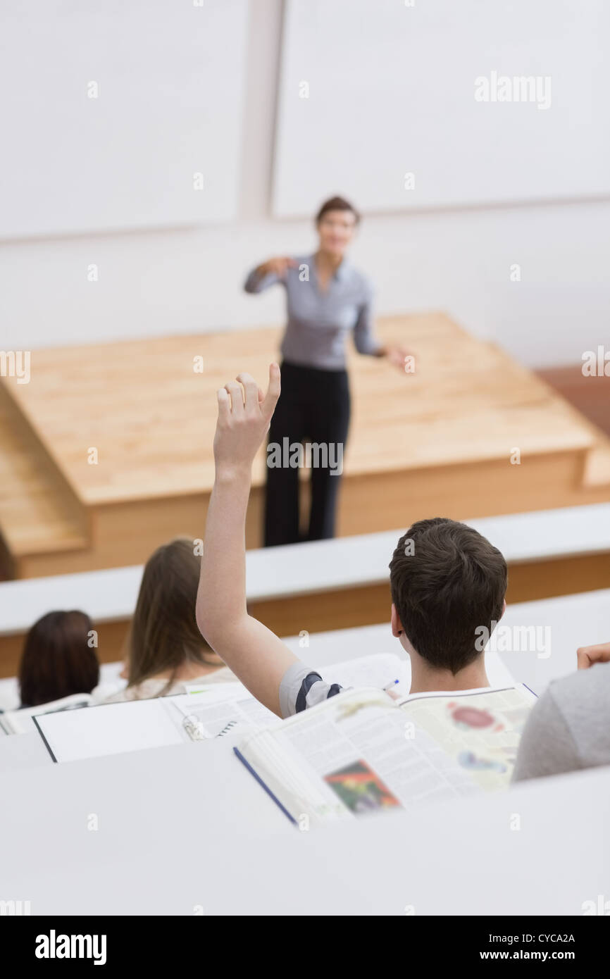 Teacher standing explaining Stock Photo - Alamy