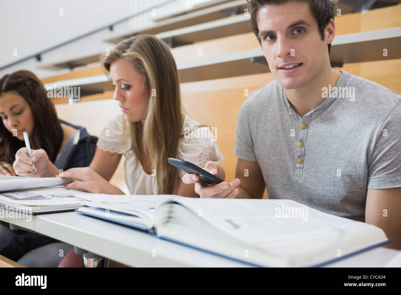 Students sitting at the desk learning Stock Photo - Alamy