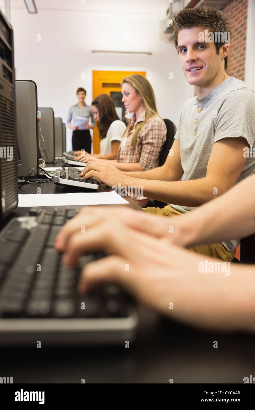 Student sitting at the computer working Stock Photo - Alamy