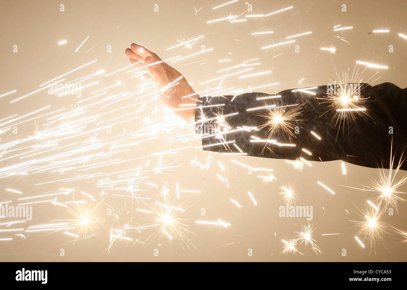 A human hand and fireworks Stock Photo - Alamy