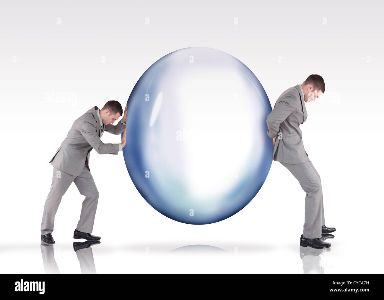 Businessmen pushing a bubble Stock Photo - Alamy