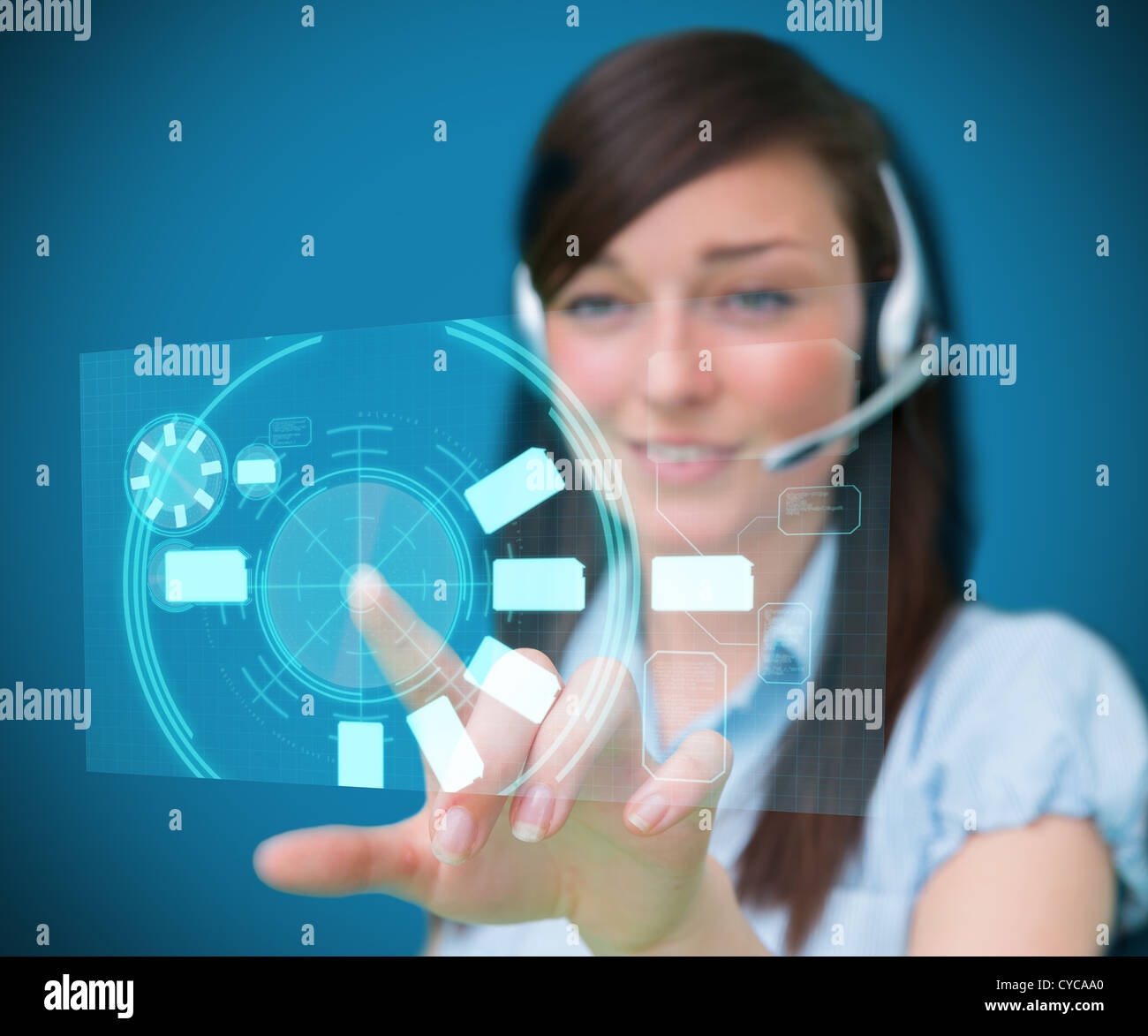 Woman wearing a head set smiling using digital interface Stock Photo ...