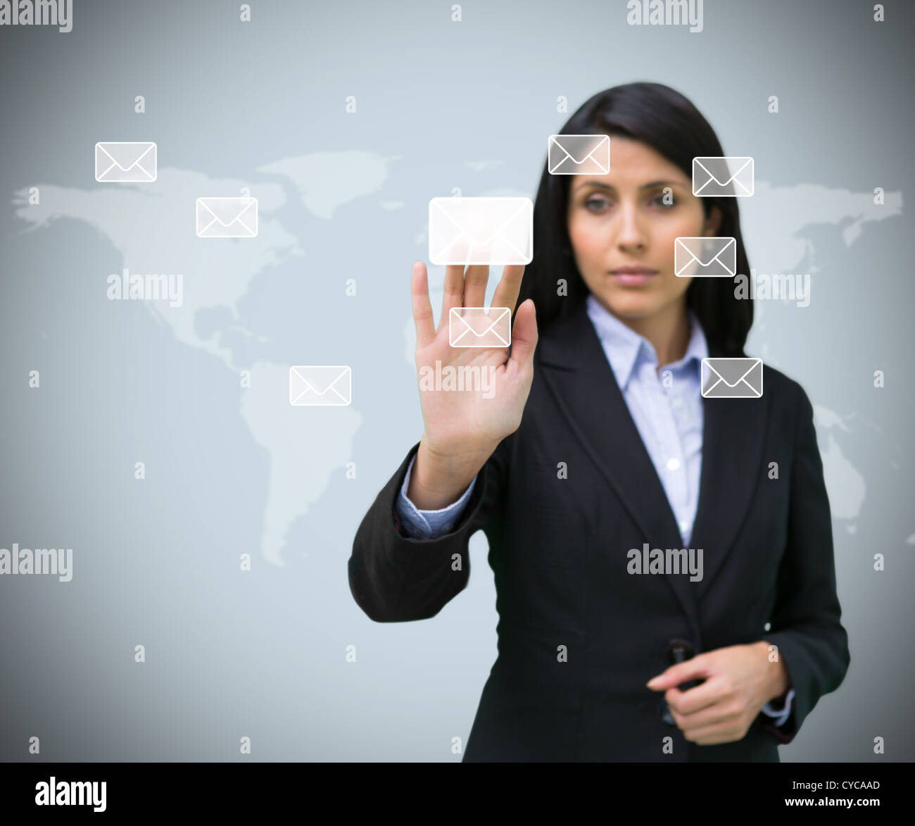 Businesswoman pushing email symbol Stock Photo - Alamy