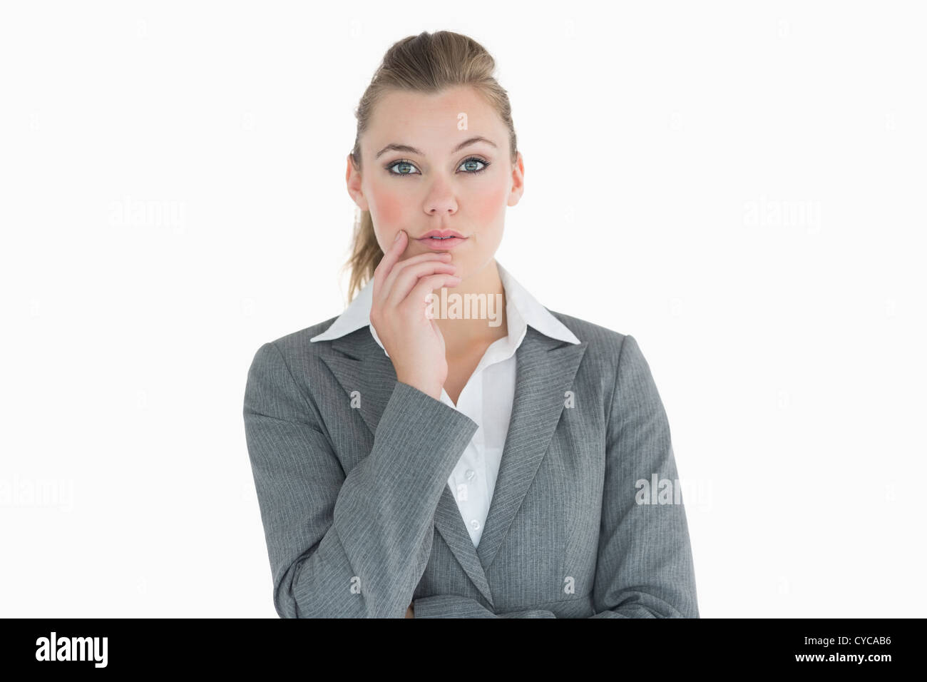 Businesswoman touching her cheek Stock Photo - Alamy