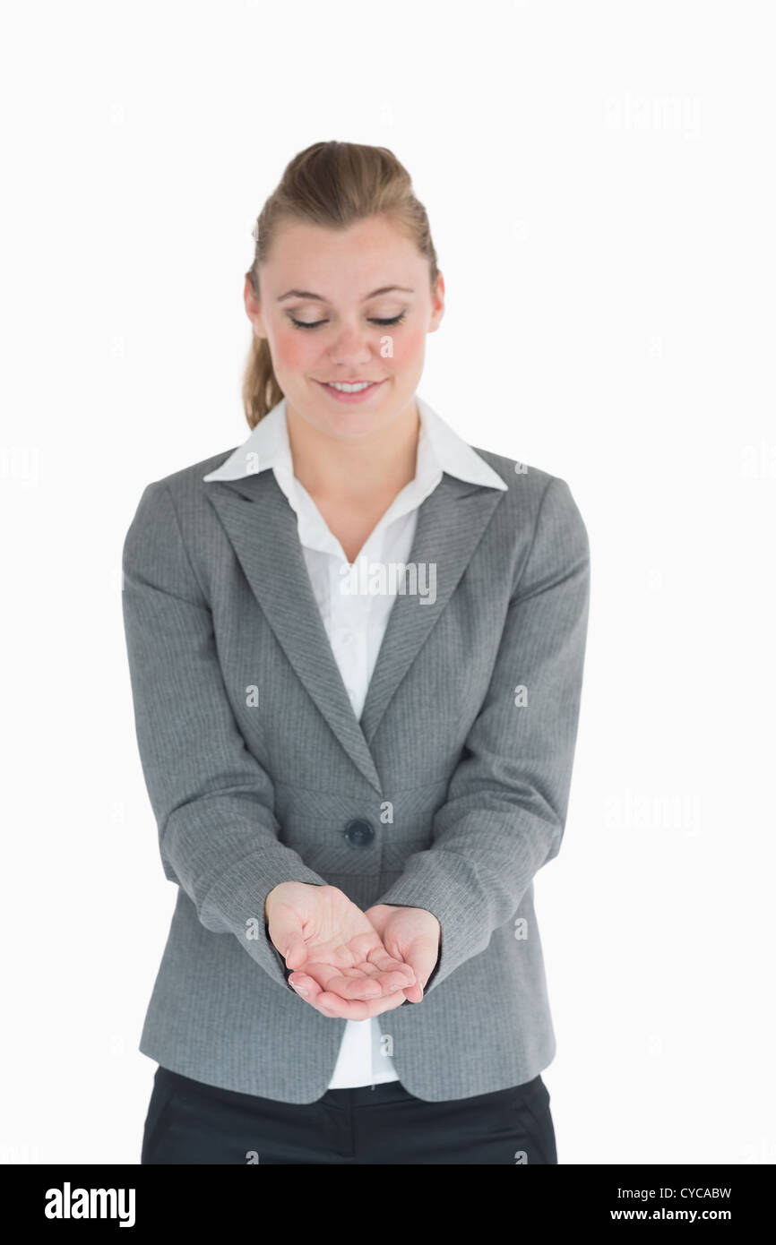 Blonde woman looking at her hands Stock Photo - Alamy