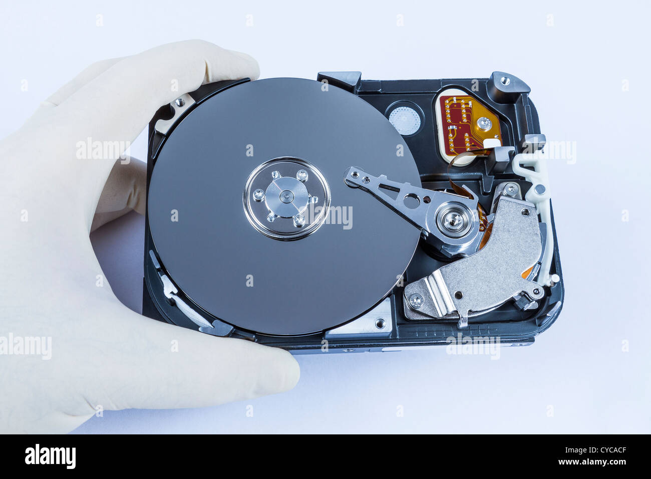 technician with open hard-disk in light background Stock Photo - Alamy