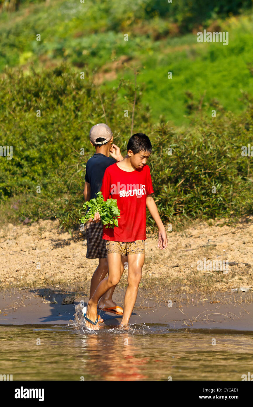 Laotian Children playing on the Banks of the River Mekong near Luang ...