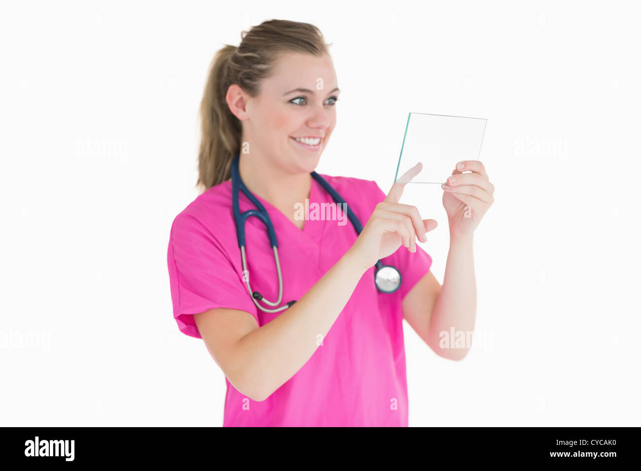 Doctor selecting something on clear pane Stock Photo - Alamy